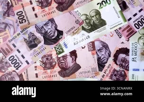 Mexican paper money, pesos in various denominations. Mexican money as a ...