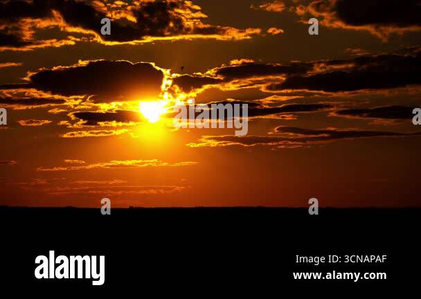 Timelapse captures a spectacular sunset as the golden sun descends ...
