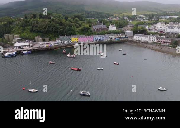 Drone shot of Portree in Isle of Skye, Colorful buildings on the ...