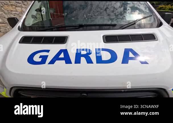DUBLIN, IRELAND - JULY 16, 2025: Garda van parking next to the castle ...