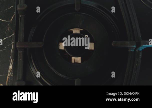 Kitchen burner is ignited in a bright blue flame, fire for cooking ...