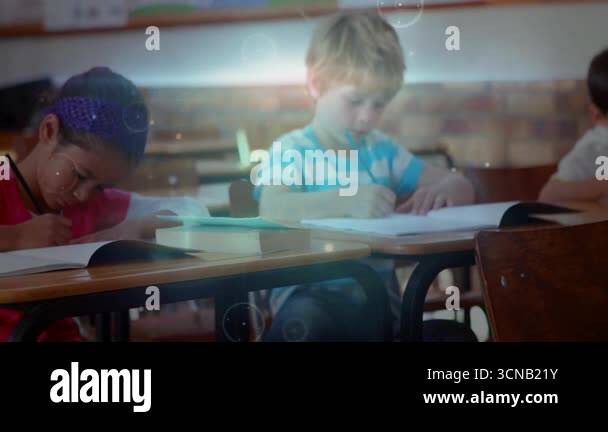 Teacher initiating writing exercise while children writing in classroom ...