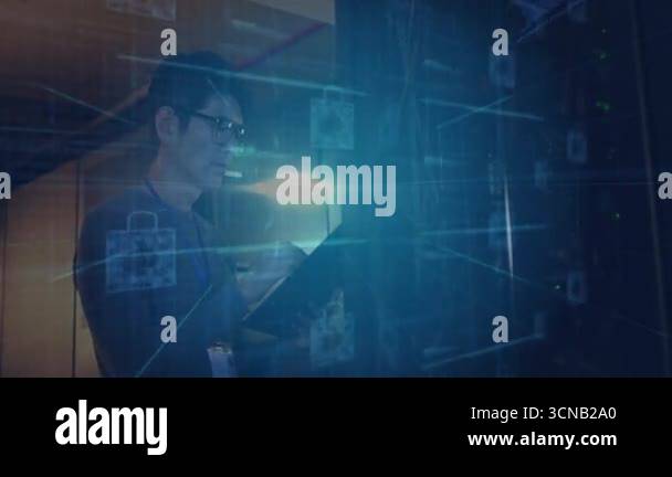 Korean man tapping tablet screen in office revealing circuit overlay ...