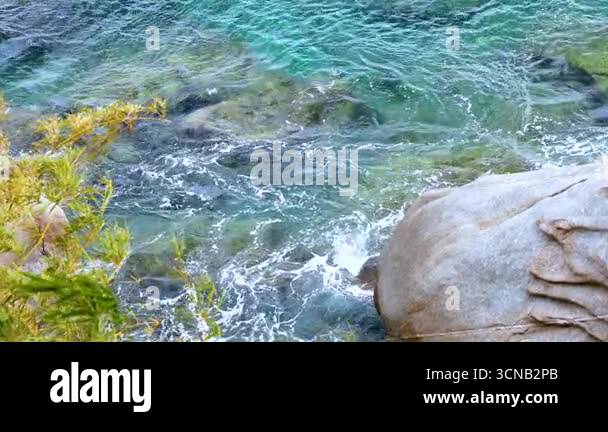 Ocean waves hitting rocks in Phuket, Thailand Stock Video Footage - Alamy