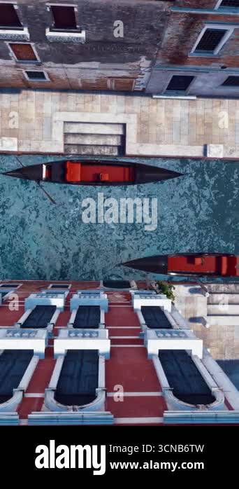 Straight overhead aerial shot of empty traditional venetian gondola ...