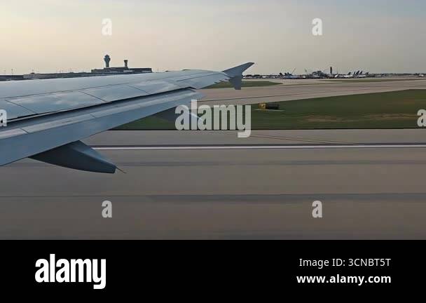 Airplane Wing View During Landing on Runway at Airport. View from ...