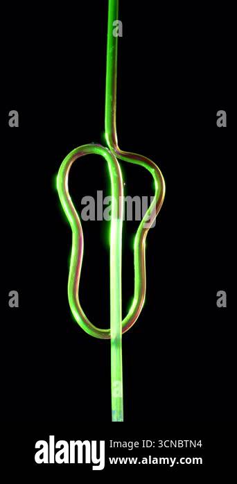 Looping neon green party straw with liquid flowing inside, glowing ...