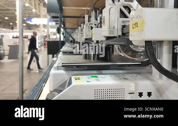 Kyiv, Ukraine, May 25, 2025: Many 3D printers printing an object. 3D ...
