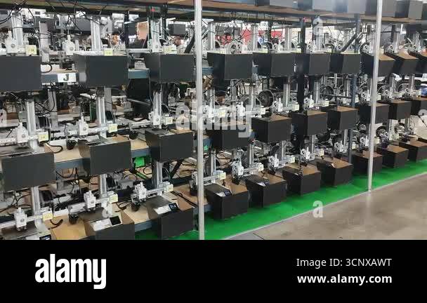 Kyiv, Ukraine, May 25, 2025: Many 3D printers printing an object. 3D ...