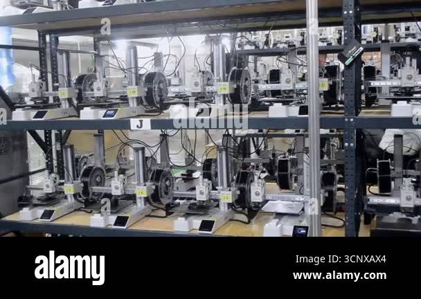 Kyiv, Ukraine, May 25, 2025: Many 3D printers printing an object. 3D ...