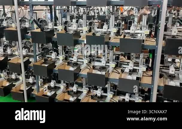 Kyiv, Ukraine, May 25, 2025: Many 3D printers printing an object. 3D ...
