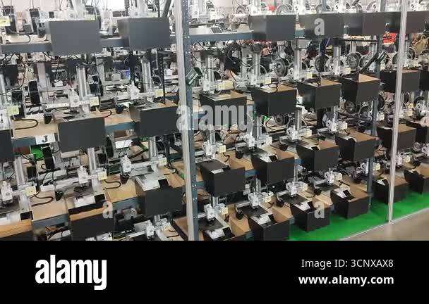 Kyiv, Ukraine, May 25, 2025: Many 3D printers printing an object. 3D ...