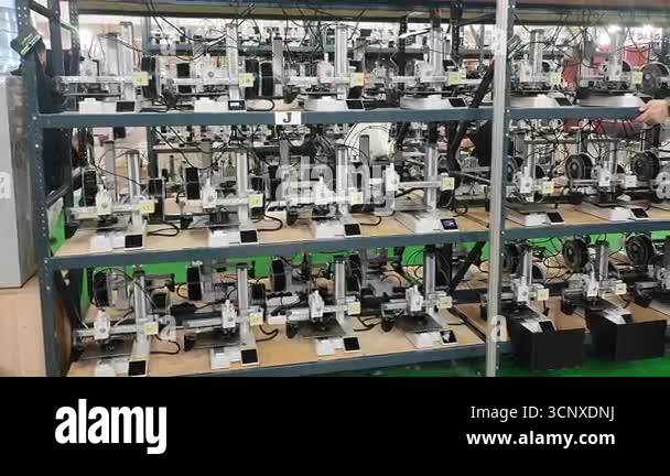 Kyiv, Ukraine, May 25, 2025: Many 3D printers printing an object. 3D ...