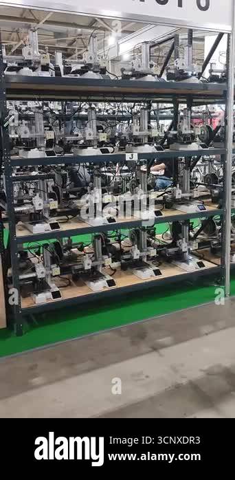 Many 3D printers printing object. 3D printers simultaneously printing ...