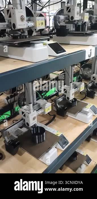 Kyiv, Ukraine, May 25, 2025: Many 3D printers printing object. 3D ...