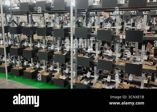 Kyiv, Ukraine, May 25, 2025: Many 3D printers printing an object. 3D ...