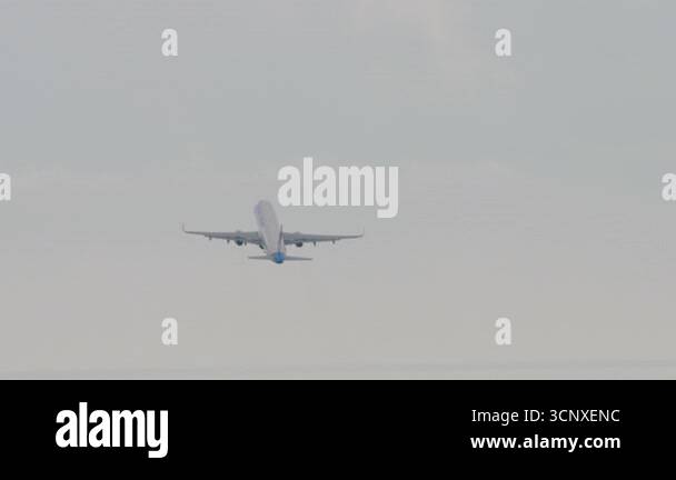 Jet passenger plane climbing in the sky after takeoff. Airliner flying ...