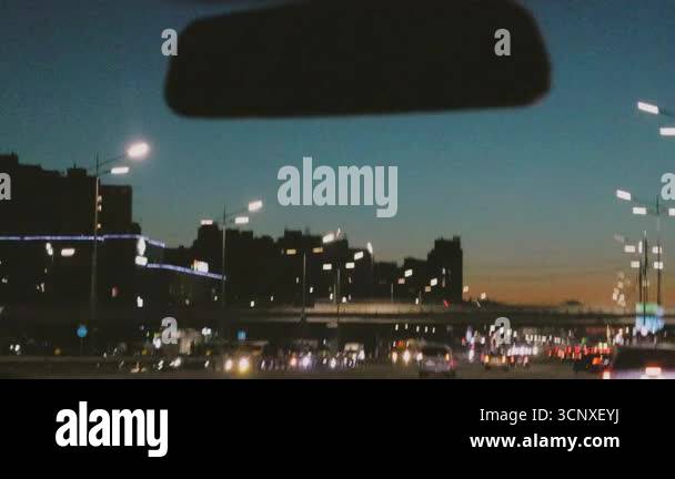 Kyiv, Ukraine 2 June 2025 Cityscape at dusk seen from inside a car with ...