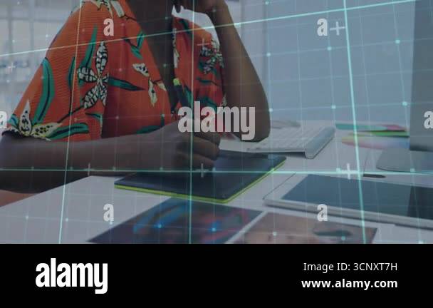Designer placing stylus on tablet activating grid overlay, sketching ...