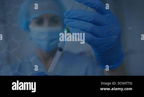 Nurse entering clinic holding vial and syringe drawing liquid checking ...