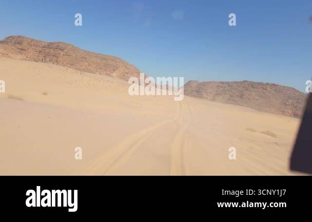 Car track in the sand, left by a off-road vehicle that rides tourists ...