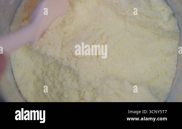 spoon pick milk powder from a container Stock Video Footage - Alamy