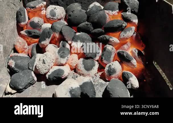 Glowing hot coals with bright heat and fiery glow inside the grill ...
