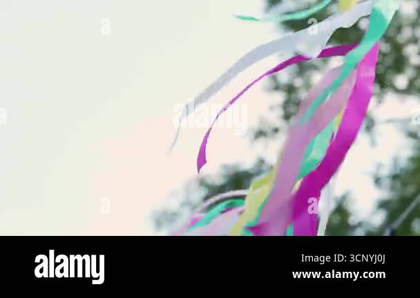 Close-up of colorful ribbons fluttering in the wind on a sunny day, set ...
