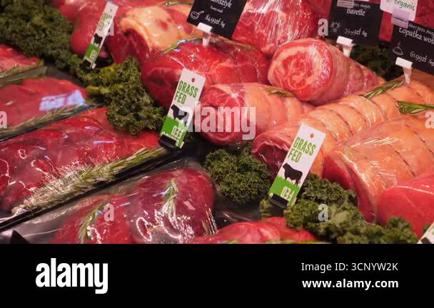 Various cuts of grass fed beef, including rumpsteak, are displayed on a ...
