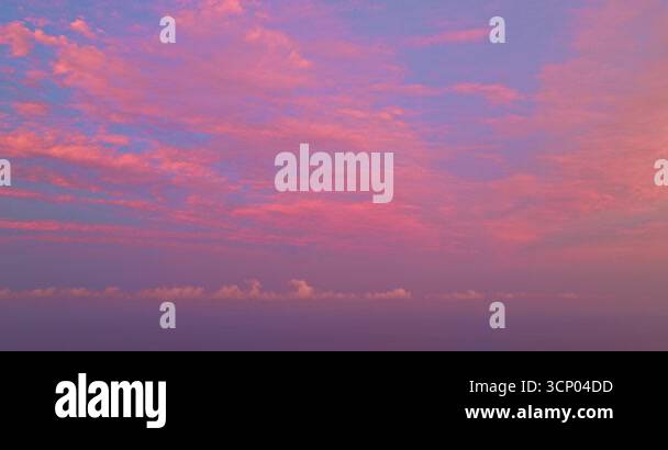Aerial view of pink sky above the island. bird eye view captures the ...