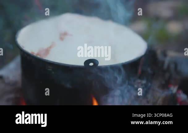 Metal pot heating over campfire Stock Videos & Footage - HD and 4K ...