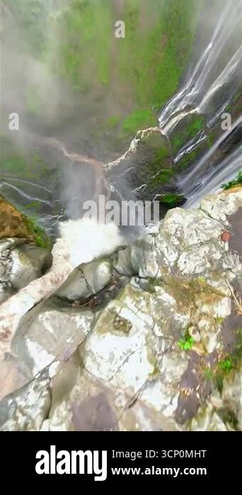 Cinematic FPV drone dive over the stunning multi-stream Tumpak Sewu ...