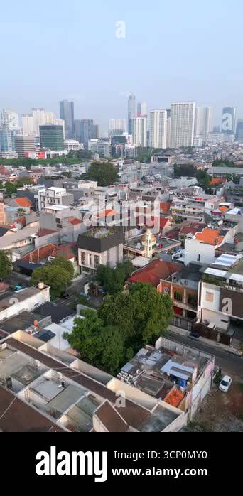 Aerial view of Jakarta city skyline with skyscrapers rising above ...