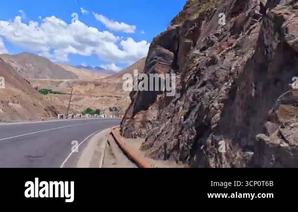 A rocky gorge with steep walls. A car ride through the Varzob gorge. A ...