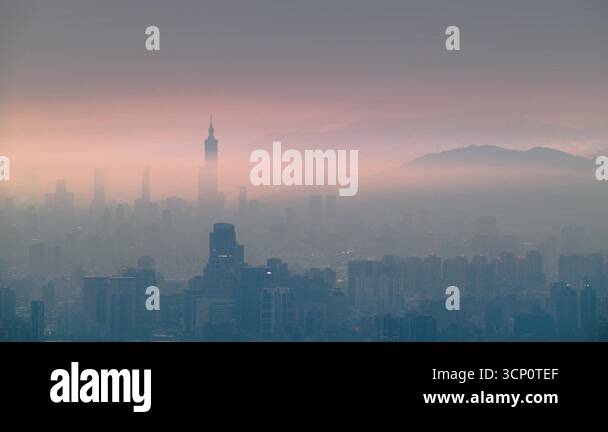 Ethereal dawn over Taipei City with Taipei 101 shrouded in orange mist ...