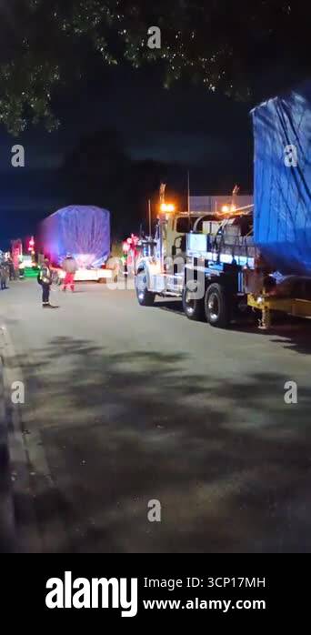 Bogot, Colombia - September 11, 2025 - A truck is loading a train car and heading towards Bosa ...