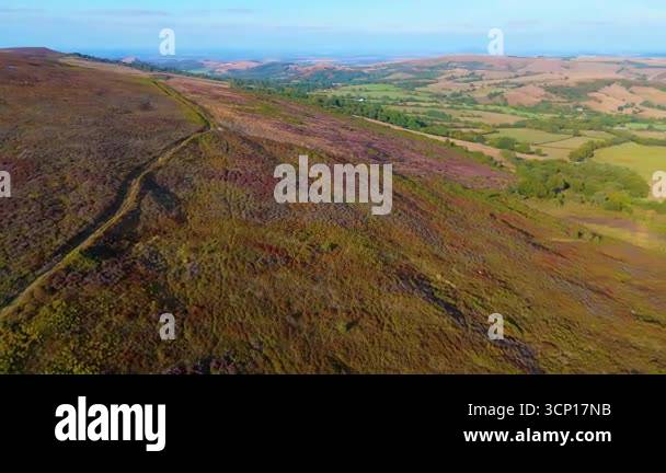 Long Mynd hill range in Shropshire, UK aerial drone shot rotating left ...