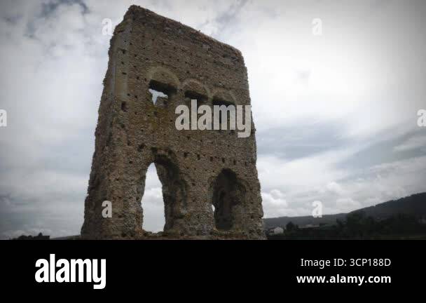 A large stone building with a mountain in the background. High quality ...