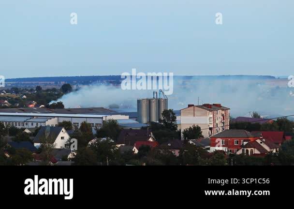 Industrial Disaster. A Factory Fire with Thick Blue Smoke and CO2 ...