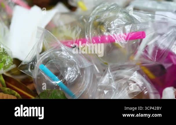Plastic waste with cups and straws showing pollution and environmental ...