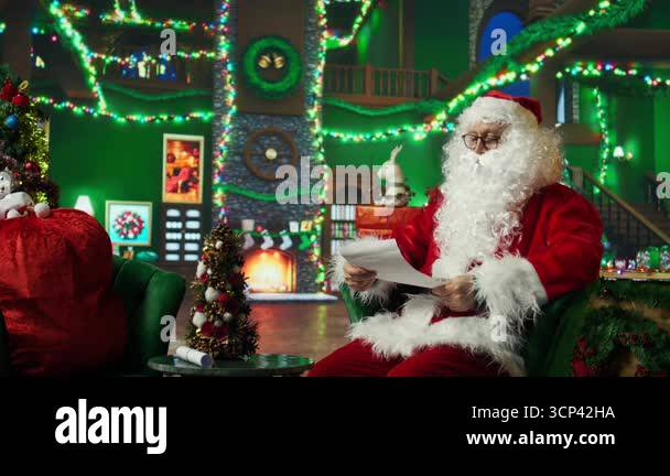 Elderly man dressed as Santa Claus opening letter received from kids ...