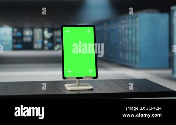 Green screen tablet in data center used for doing maintenance on ...