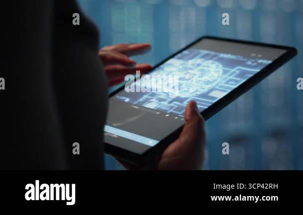 Data center technician using machine learning on tablet to optimize operations. IT specialist ...