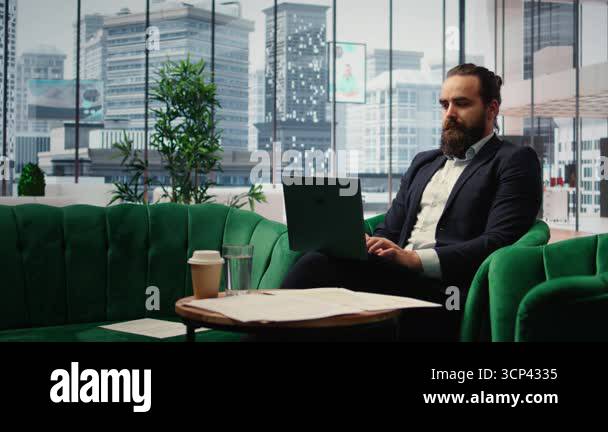 Male leader sitting in a smart office demonstrating authority and ...