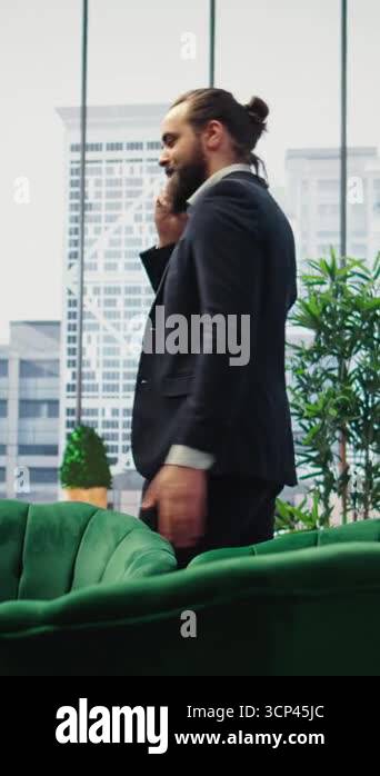 Vertical Video CEO multitasking and managing an important phone call ...