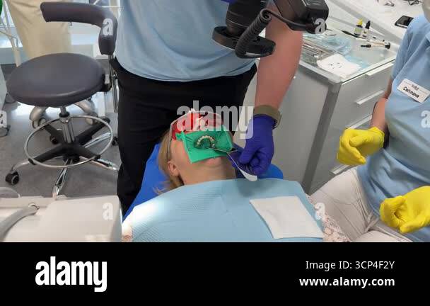 Cofferdam dental treatment under a microscope rubber band in dentistry ...