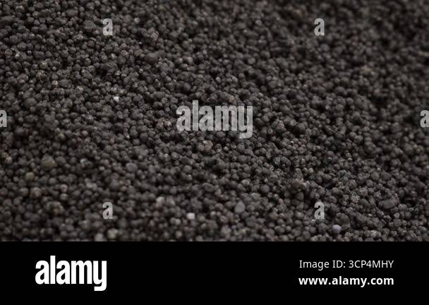 Close up of granular material transitions to liquid foam concrete ...