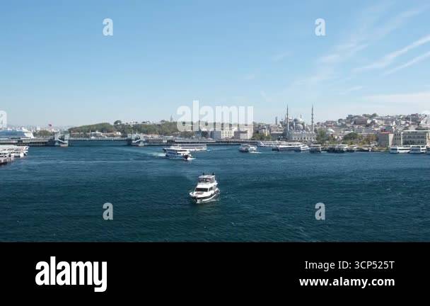 Sunny Golden Horn waterway with boats and Metro Bridge in Istanbul ...