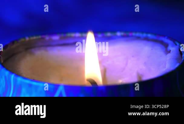 Macro - Candle flame burning in the night Stock Video Footage - Alamy