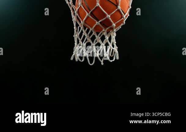 Super slow motion of basketball ball hitting the basket . Filmed on ...